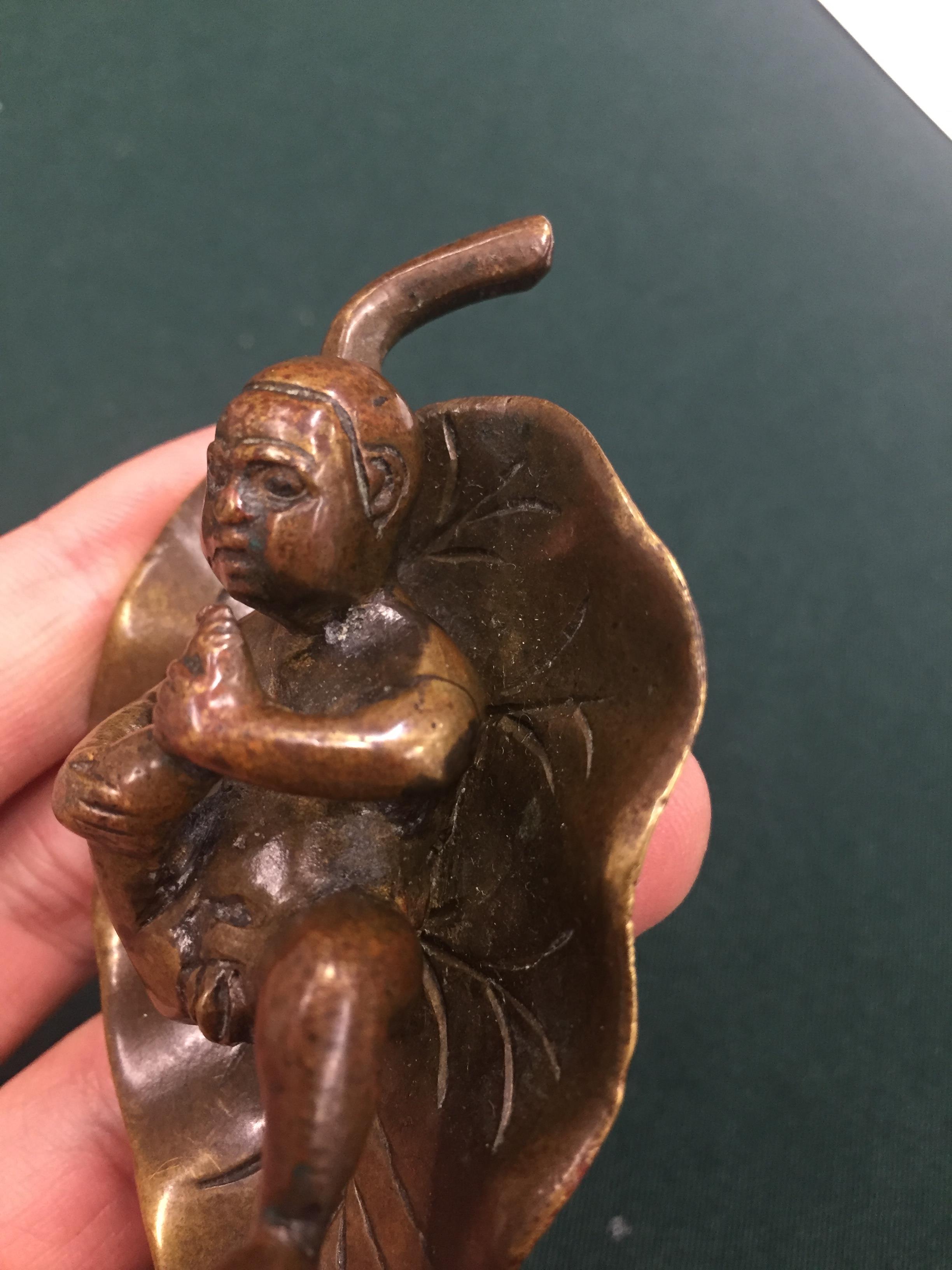 Lot 534 - TWO CHINESE BRONZE SCROLL WEIGHTS