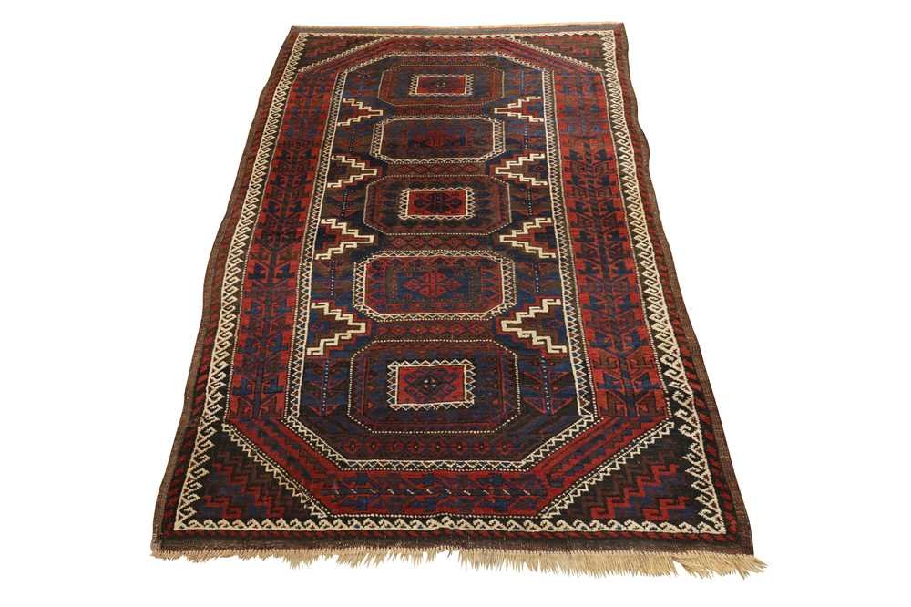 Lot 58 - AN UNUSUAL ANTIQUE BALOUCH RUG, NORTH-EAST