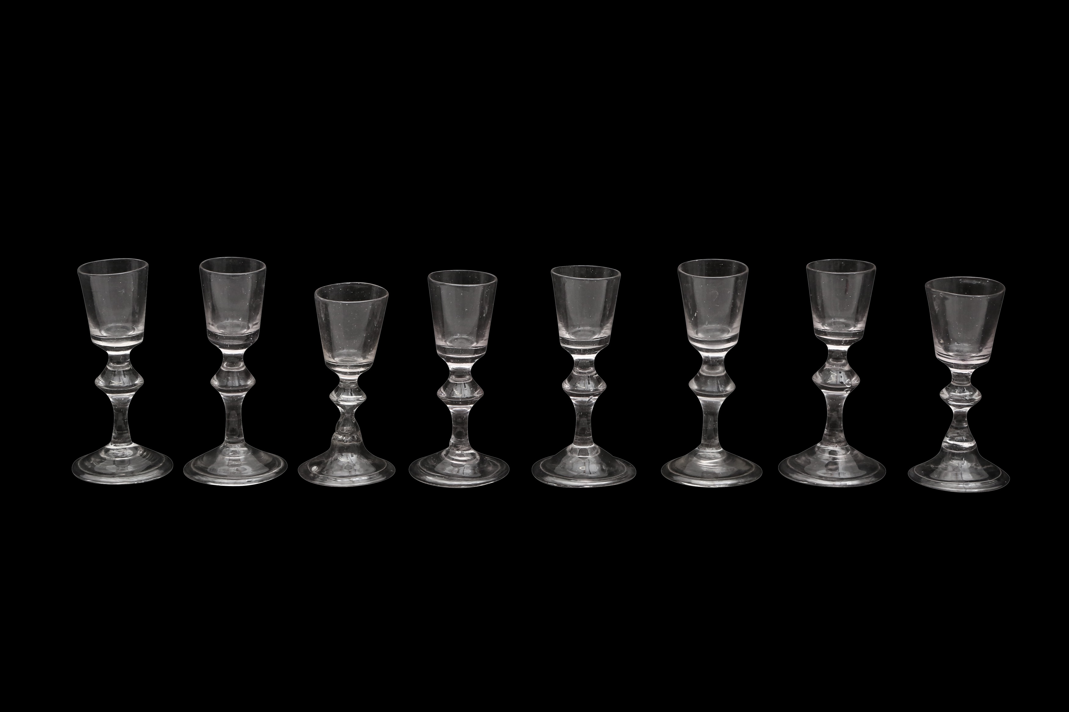 Lot 187 - A SET OF EIGHT 18TH CENTURY CORDIAL GLASSES