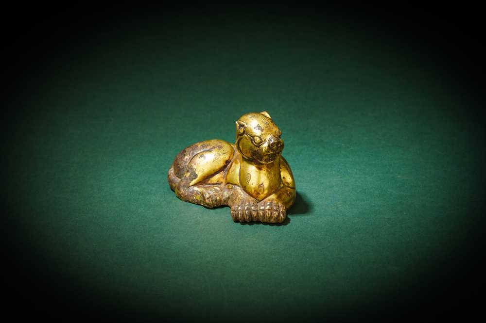 Lot 191 - A CHINESE GILT-BRONZE 'LEOPARD' FIGURE