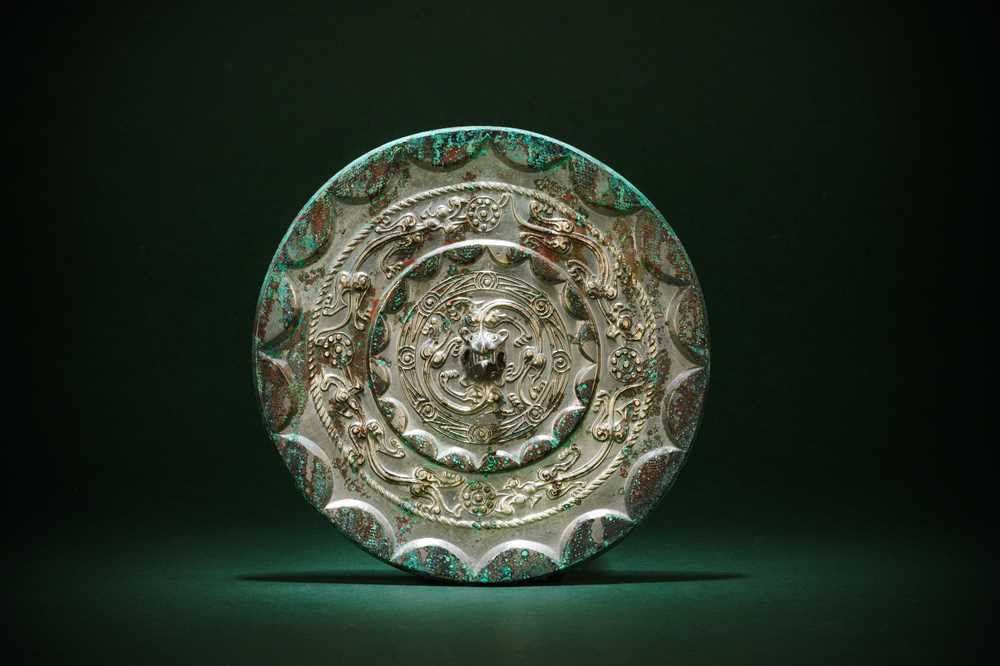 Lot 231 - A CHINESE SILVERY BRONZE 'CHILONG' MIRROR