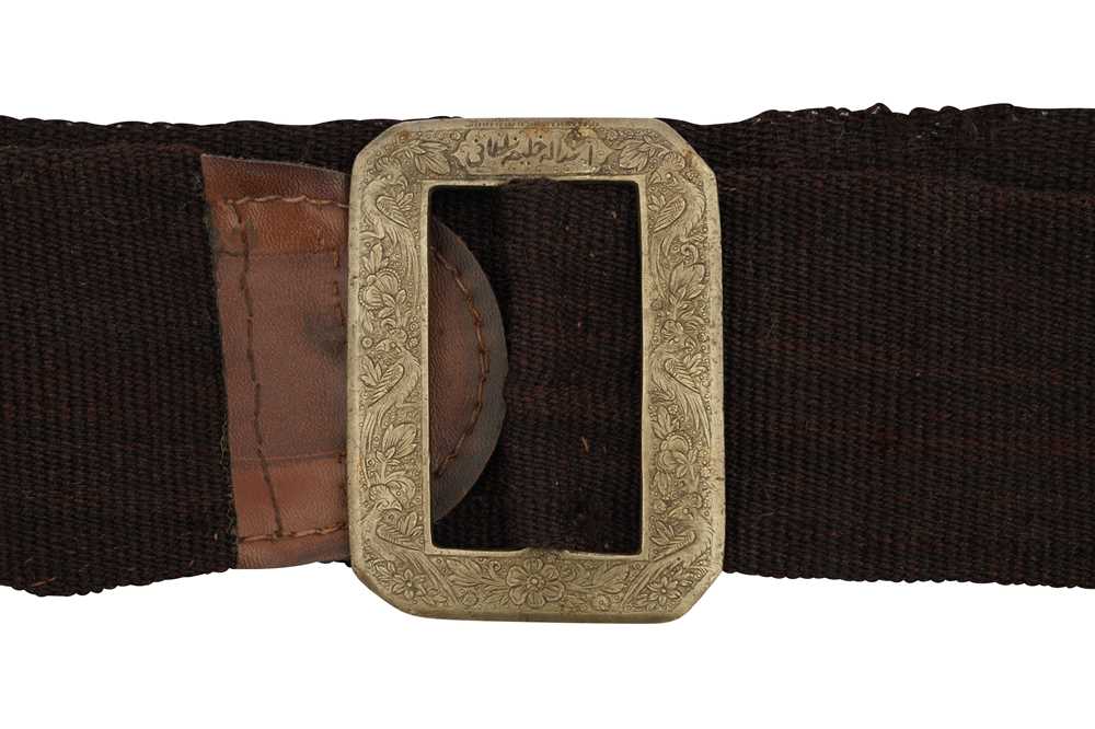 Lot 34 - A BROWN-DYED COARSE WOOL BELT WITH AN