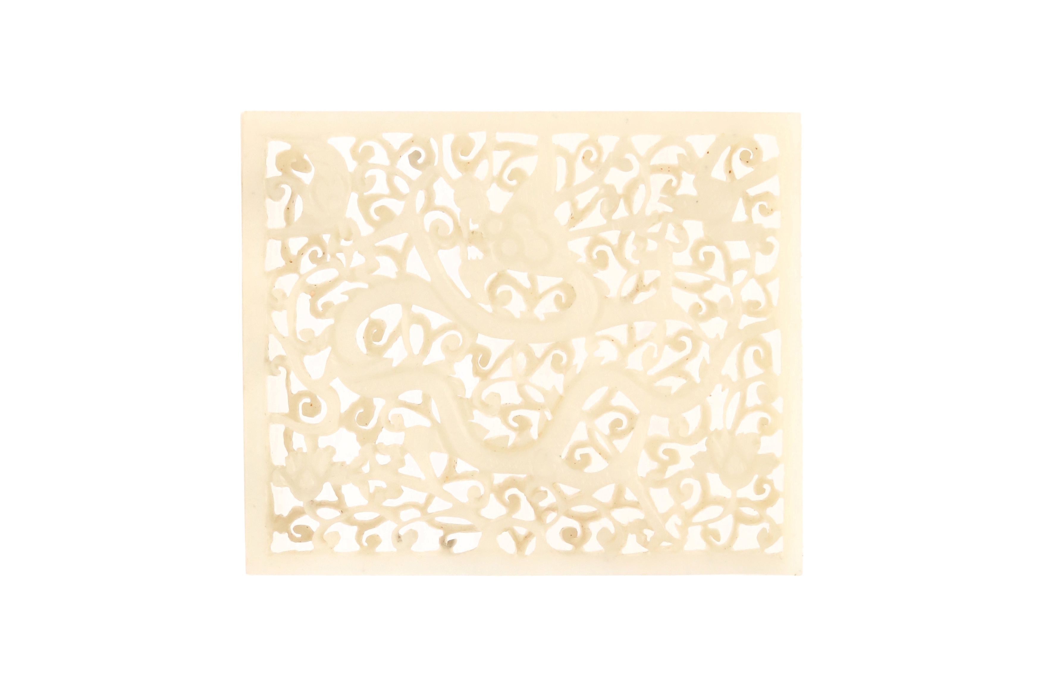 Lot 120 - A CHINESE WHITE JADE RETICULATED 'DRAGON'