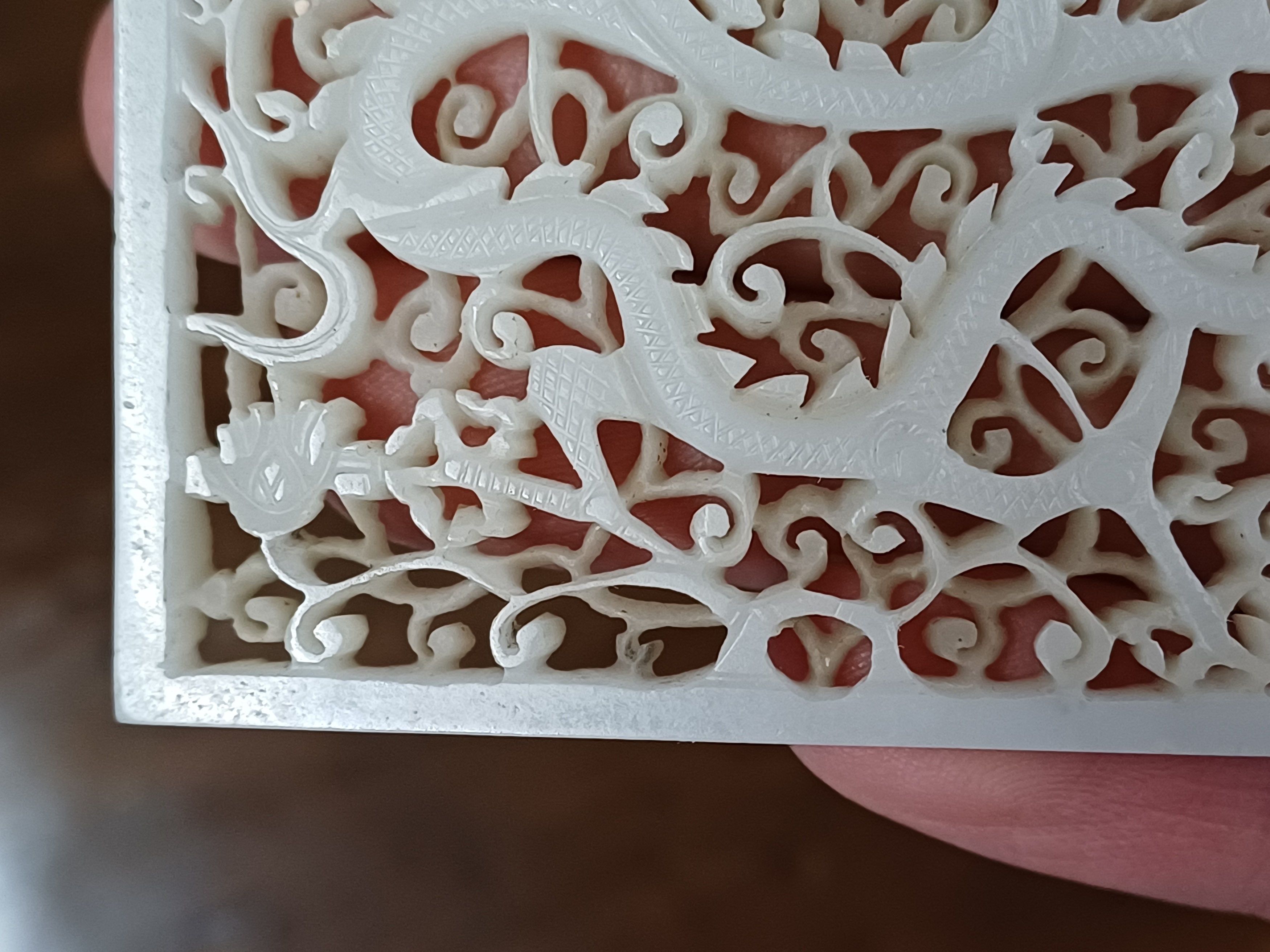 Lot 120 - A CHINESE WHITE JADE RETICULATED 'DRAGON'