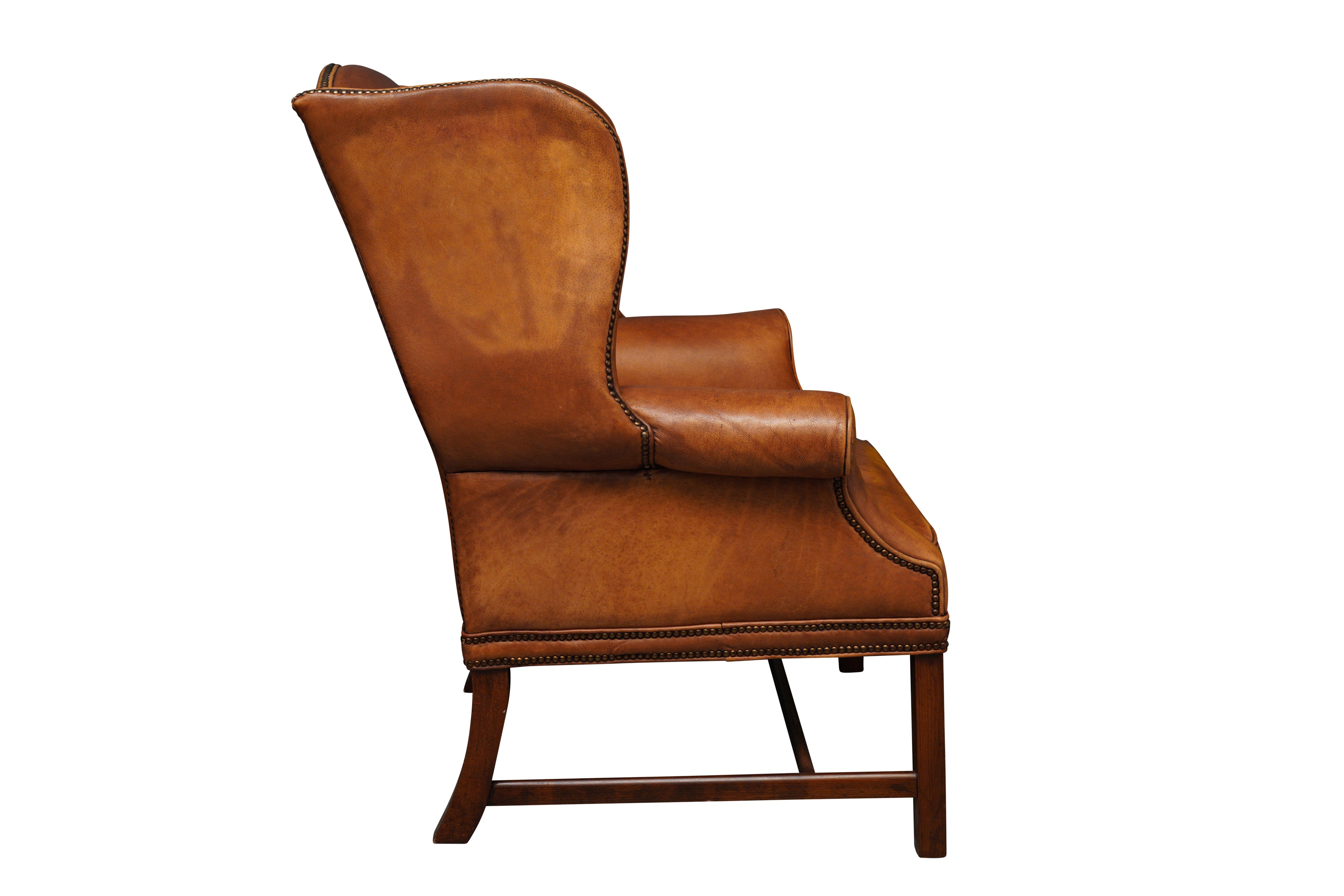 Lot 369 - A GEORGIAN STYLE TAN LEATHER WINGBACK