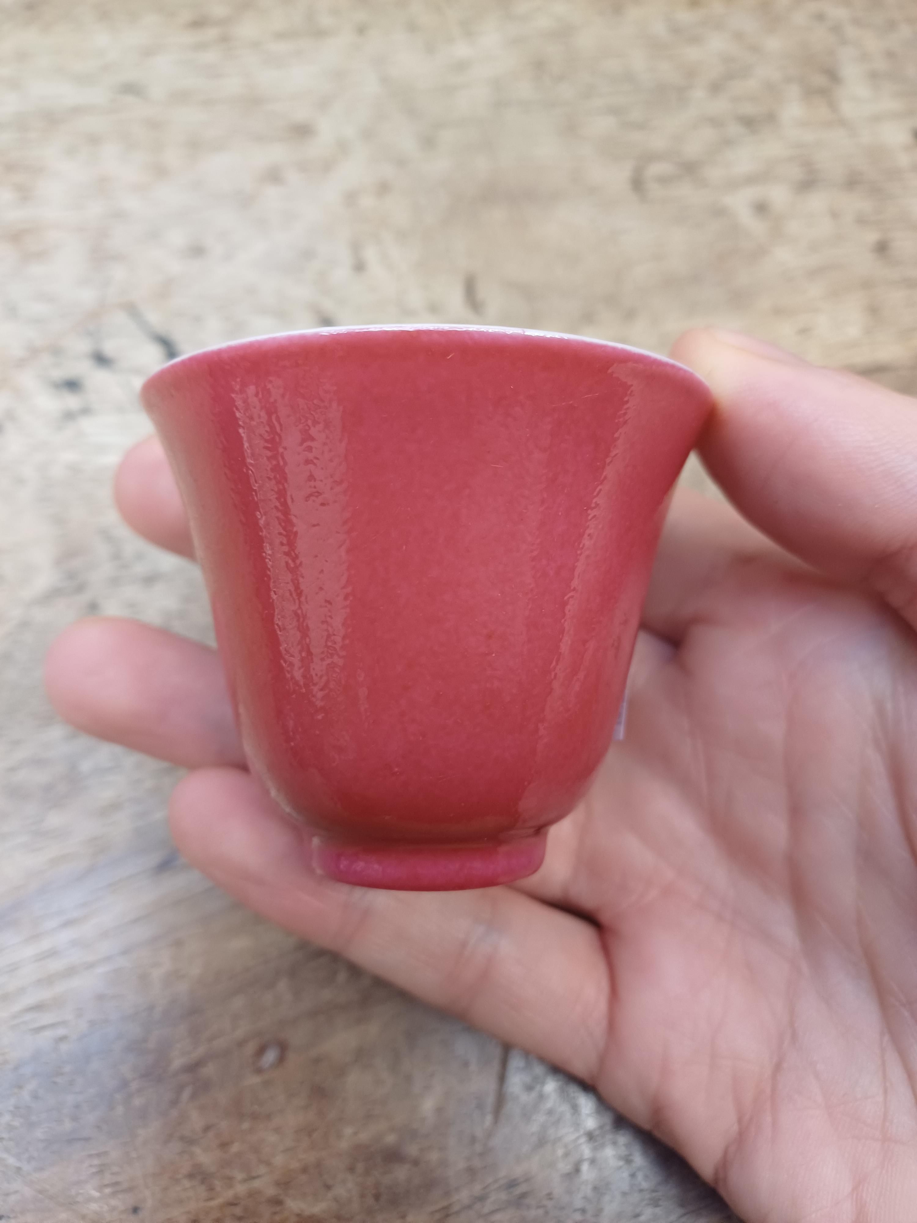 Lot 102 - A CHINESE MONOCHROME RUBY-GLAZED CUP