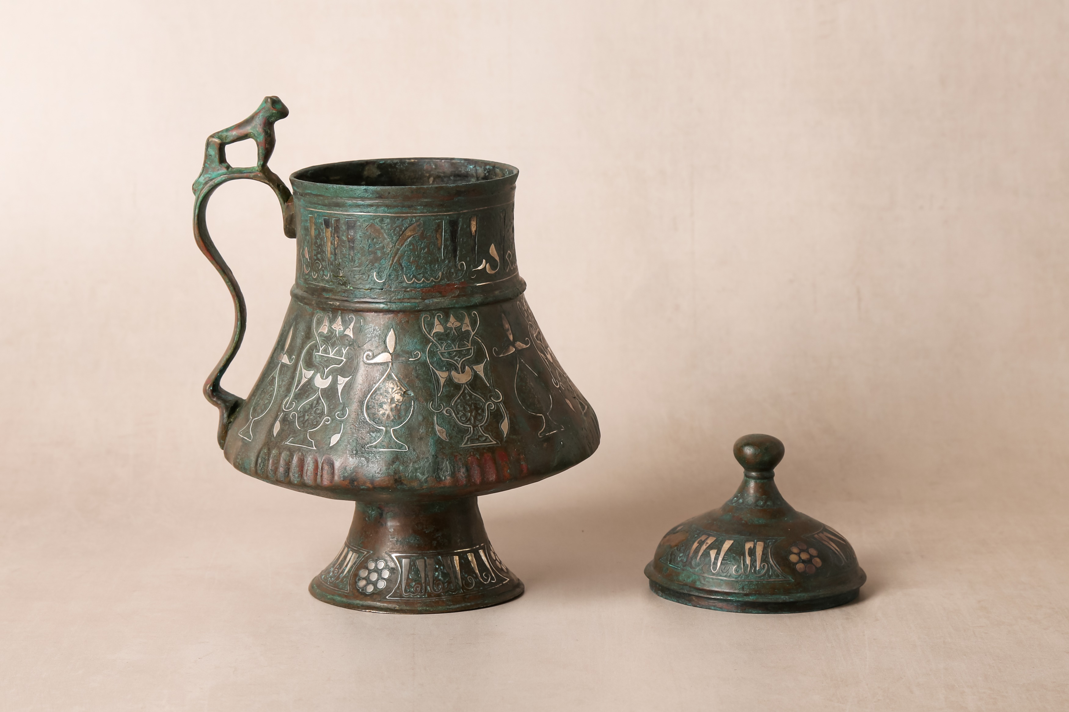 Lot 75 - A 12TH CENTURY PERSIAN SELJUK BRONZE JUG
