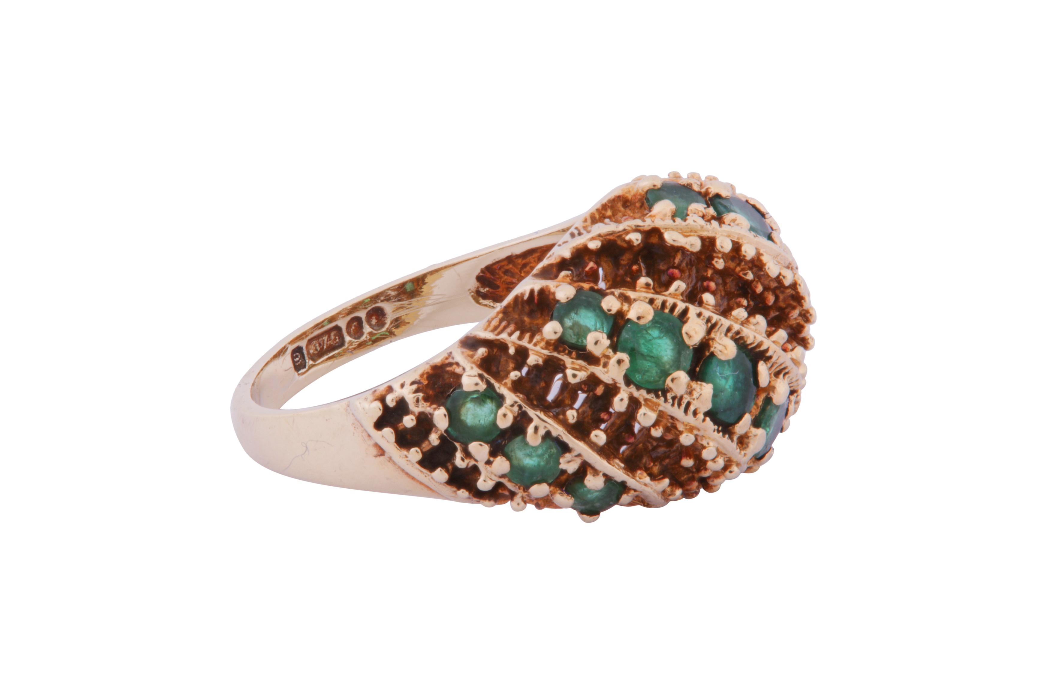 Lot 261 - AN EMERALD BOMBÉ RING, CIRCA 1979