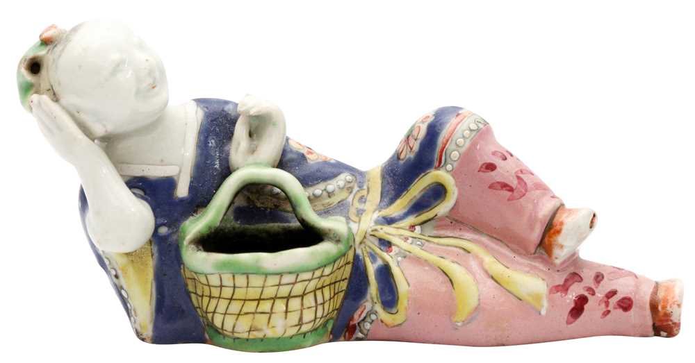 Lot 72 - A SMALL CHINESE FAMILLE-ROSE 'RECLINING LADY'