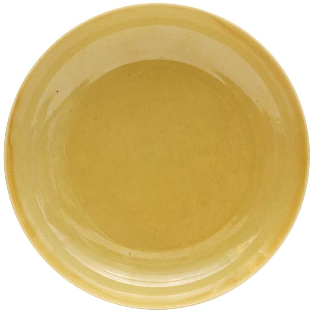 Lot 205 - A CHINESE MONOCHROME YELLOW-GLAZED DISH