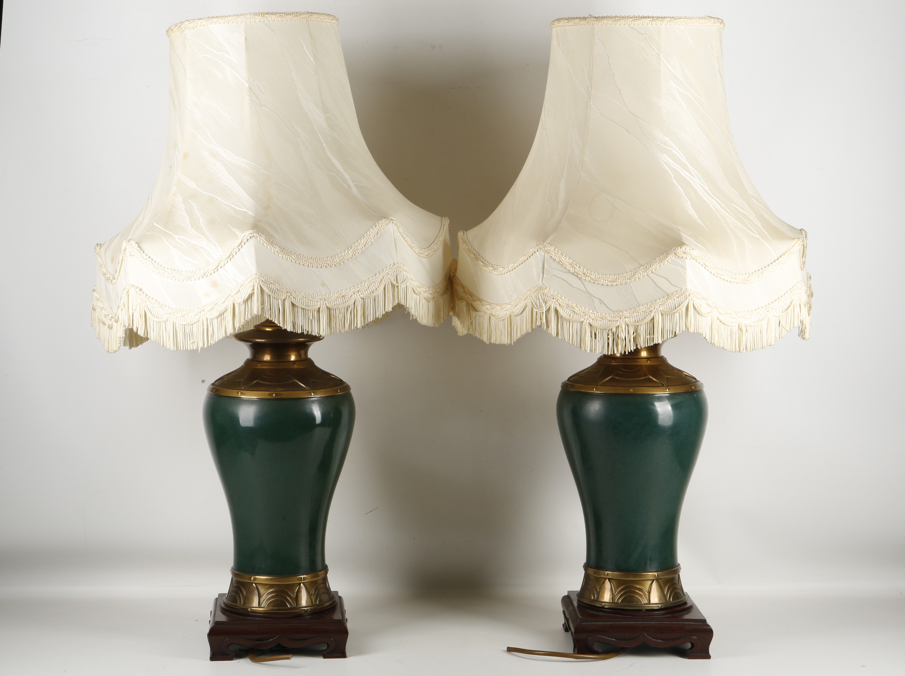 Lot 523 - A pair of table lamps, brass leaf collar