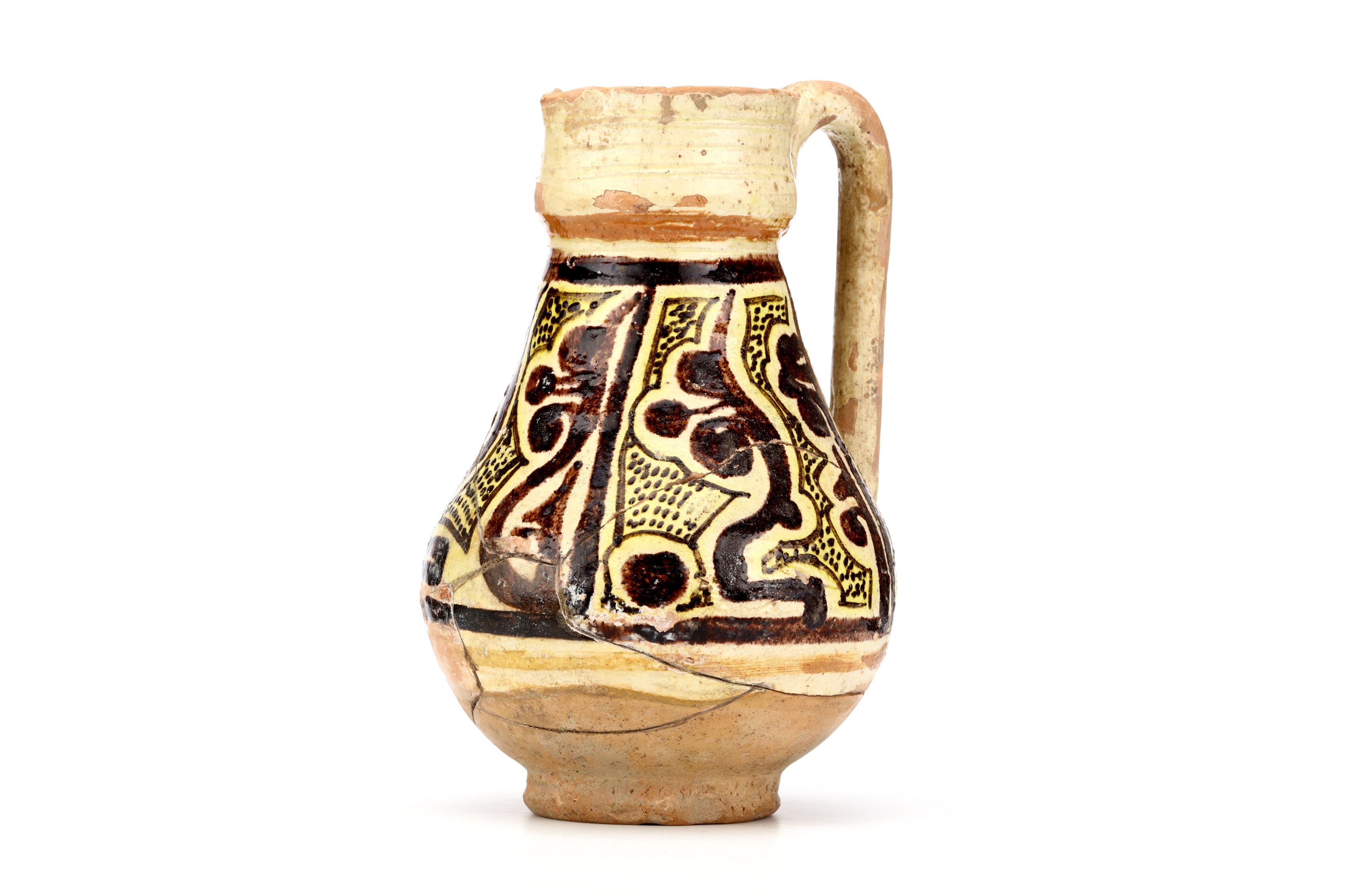 Lot 18 - A NISHAPUR GLAZED CERAMIC JUG, decorated with