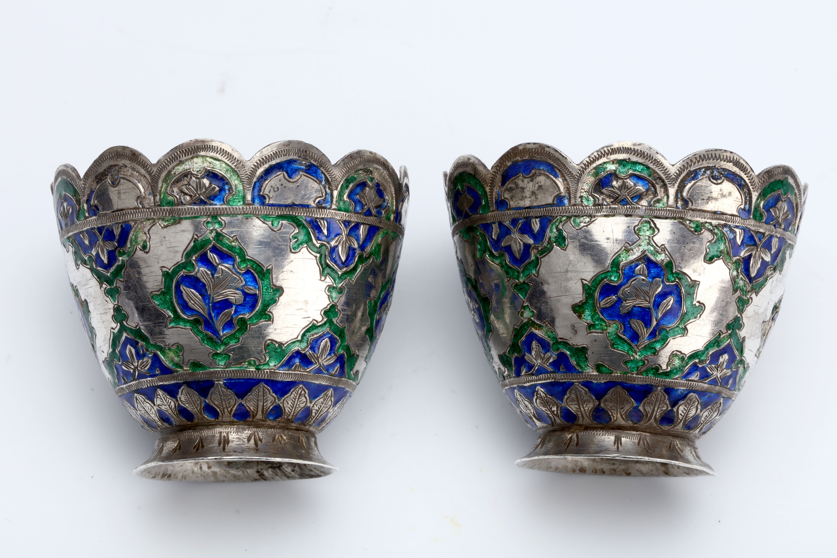 Lot 100 - FOUR PERSIAN QAJAR SILVER CUPS, with blue