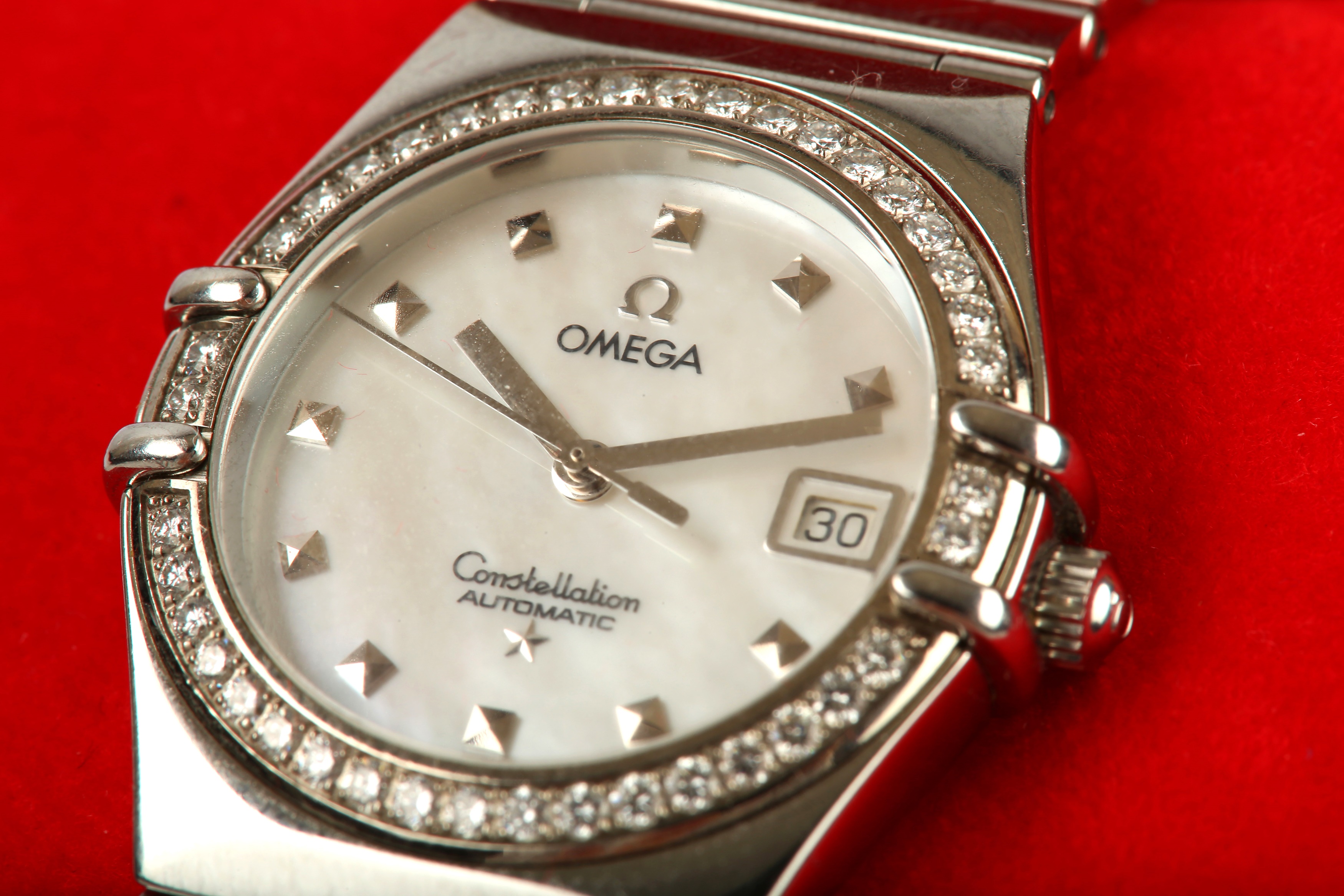 Lot 3 - OMEGA. A LADIES STAINLESS STEEL AND DIAMOND