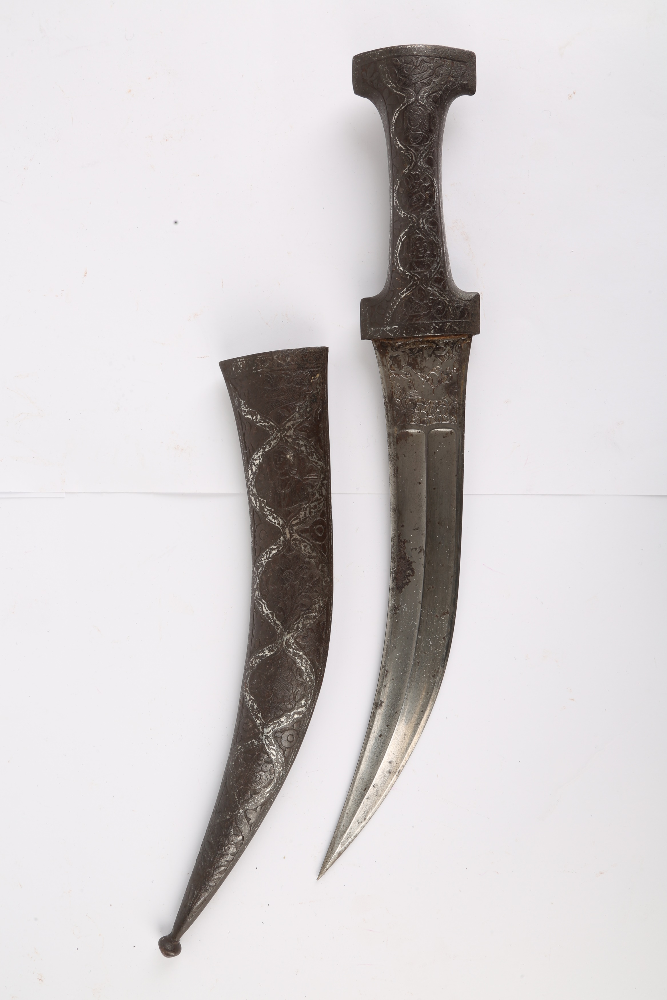 Lot 177 - A QAJAR SILVER-INLAID DAGGER Iran, mid-19th