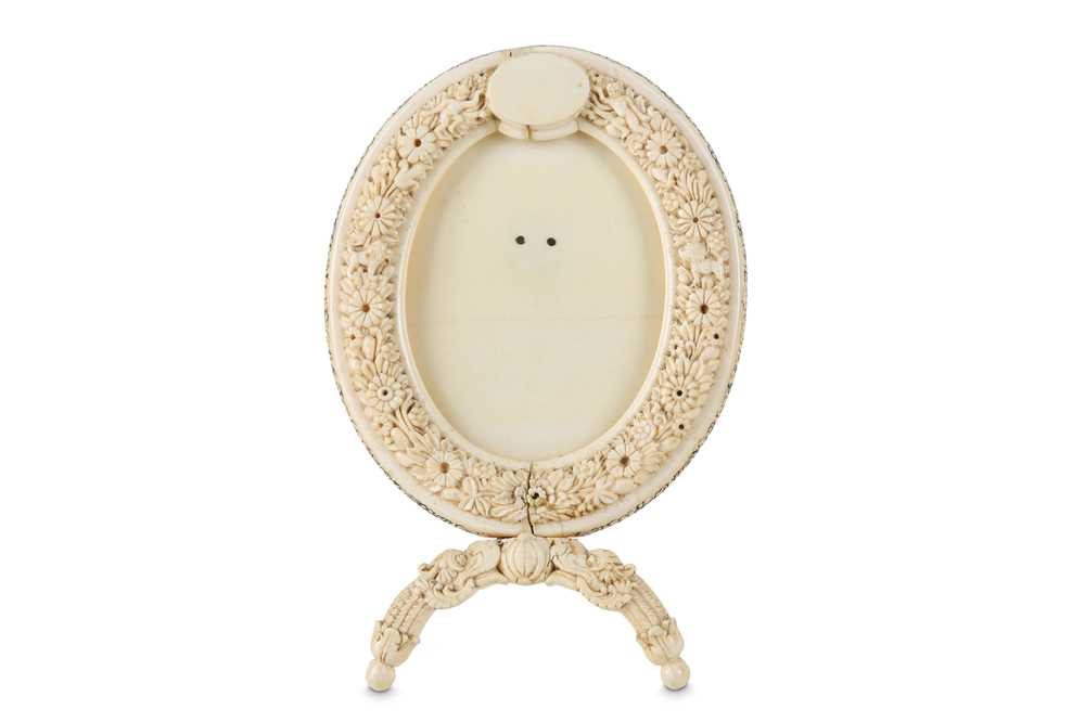 Lot 173 - A CARVED IVORY PICTURE FRAME India, late