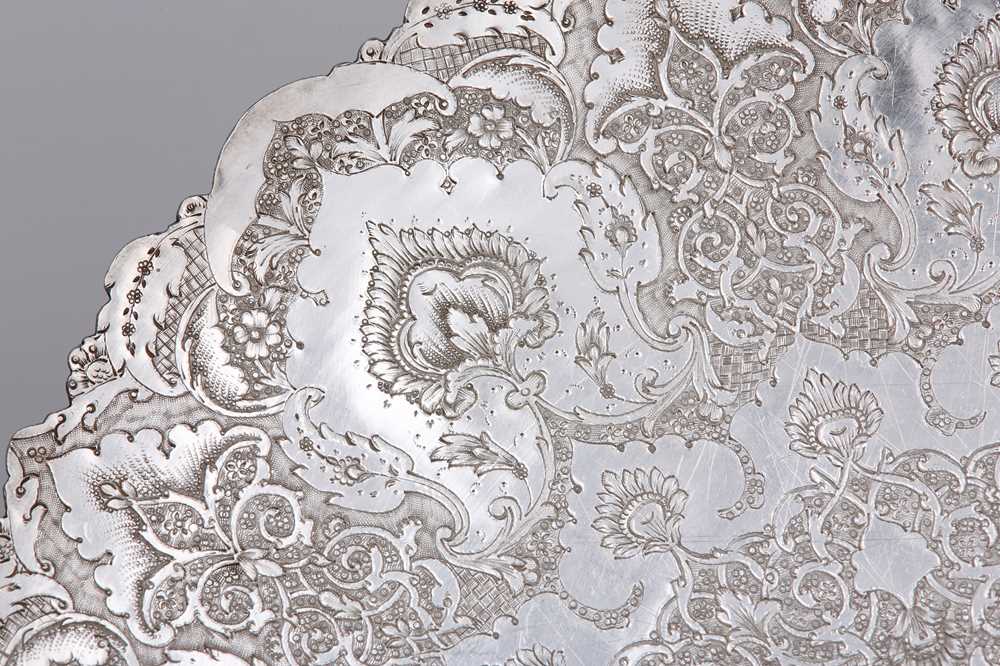 Lot 166 - A LATE QAJAR SILVER SERVING DISH Iran, first