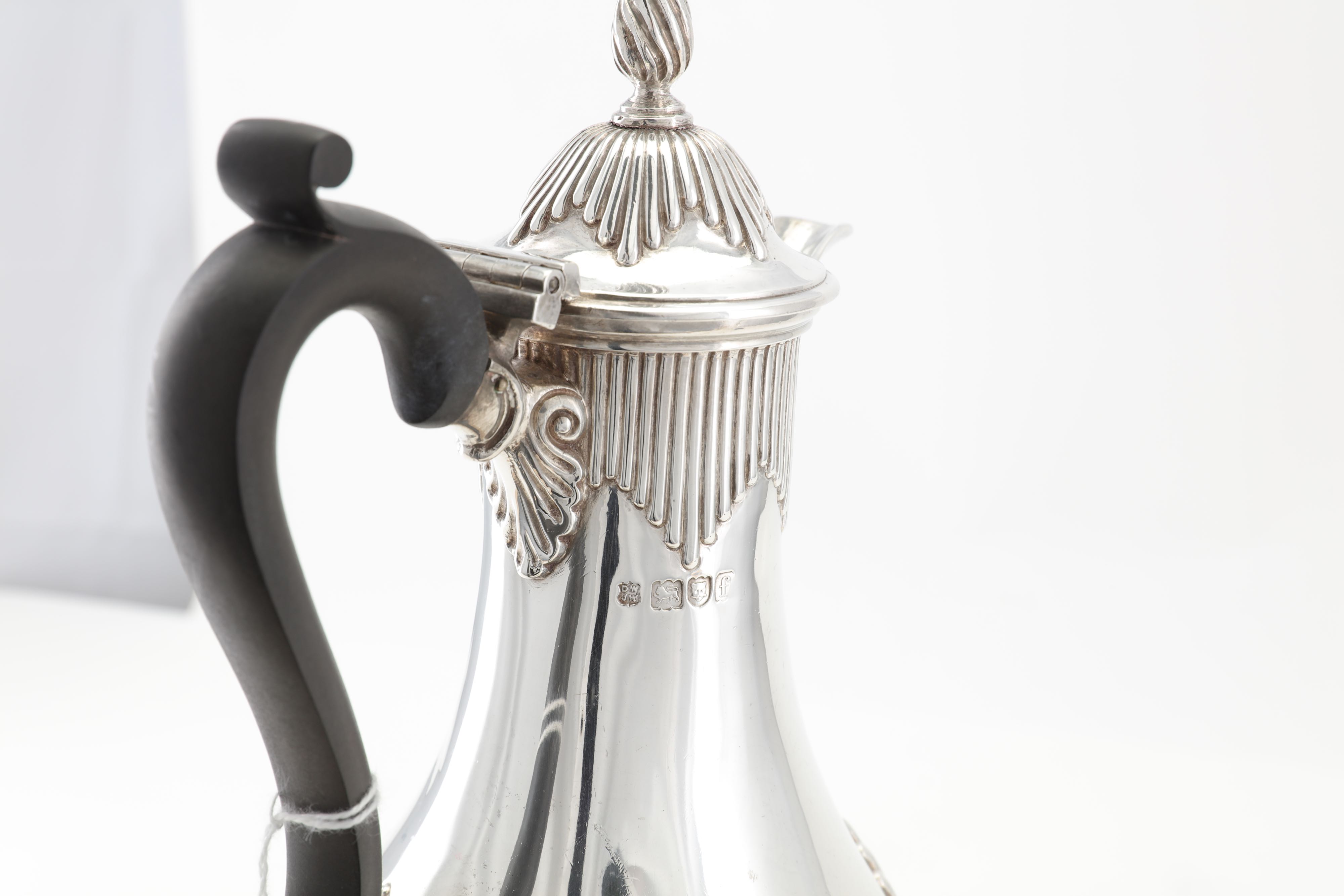 Lot 231 - An Edwardian sterling silver hot water pot,