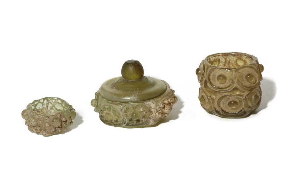 Lot 177 - THREE GREEN GLASS PYXIDES Circa 11th Century