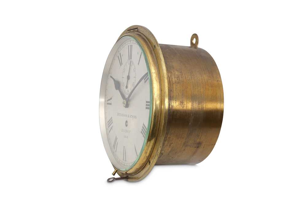 Lot 70 - A 19TH CENTURY BRASS BULKHEAD CLOCK