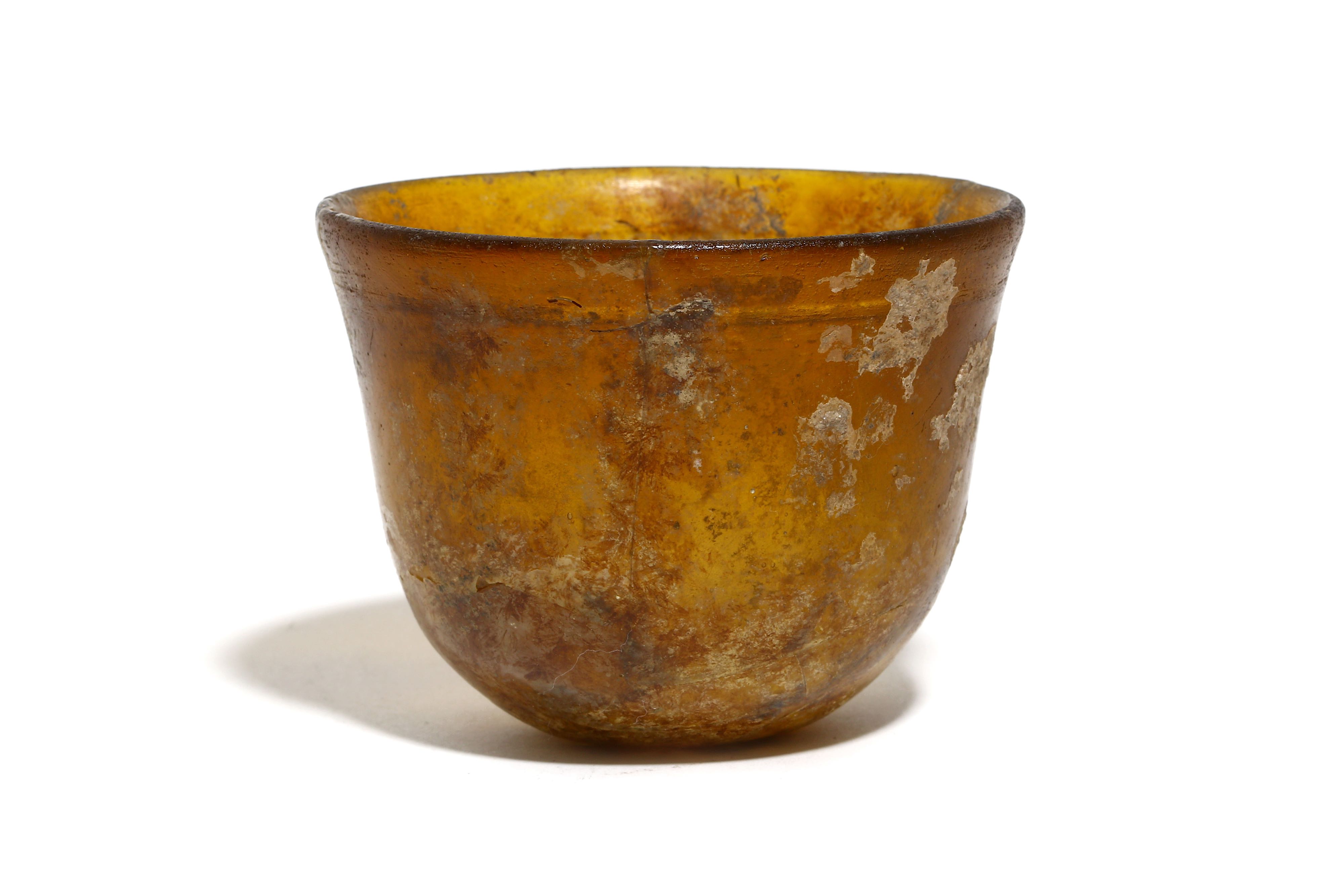 Lot 161 - A ROMAN AMBER GLASS BEAKER Circa 1st - 2nd