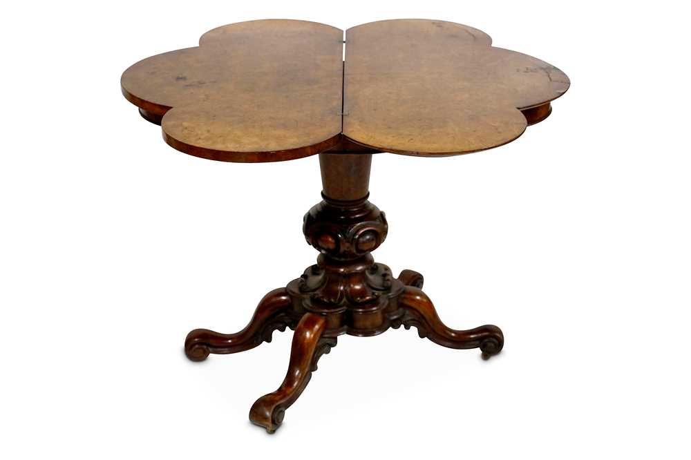 Lot 791 - A Victorian burr walnut tea table, the lobed