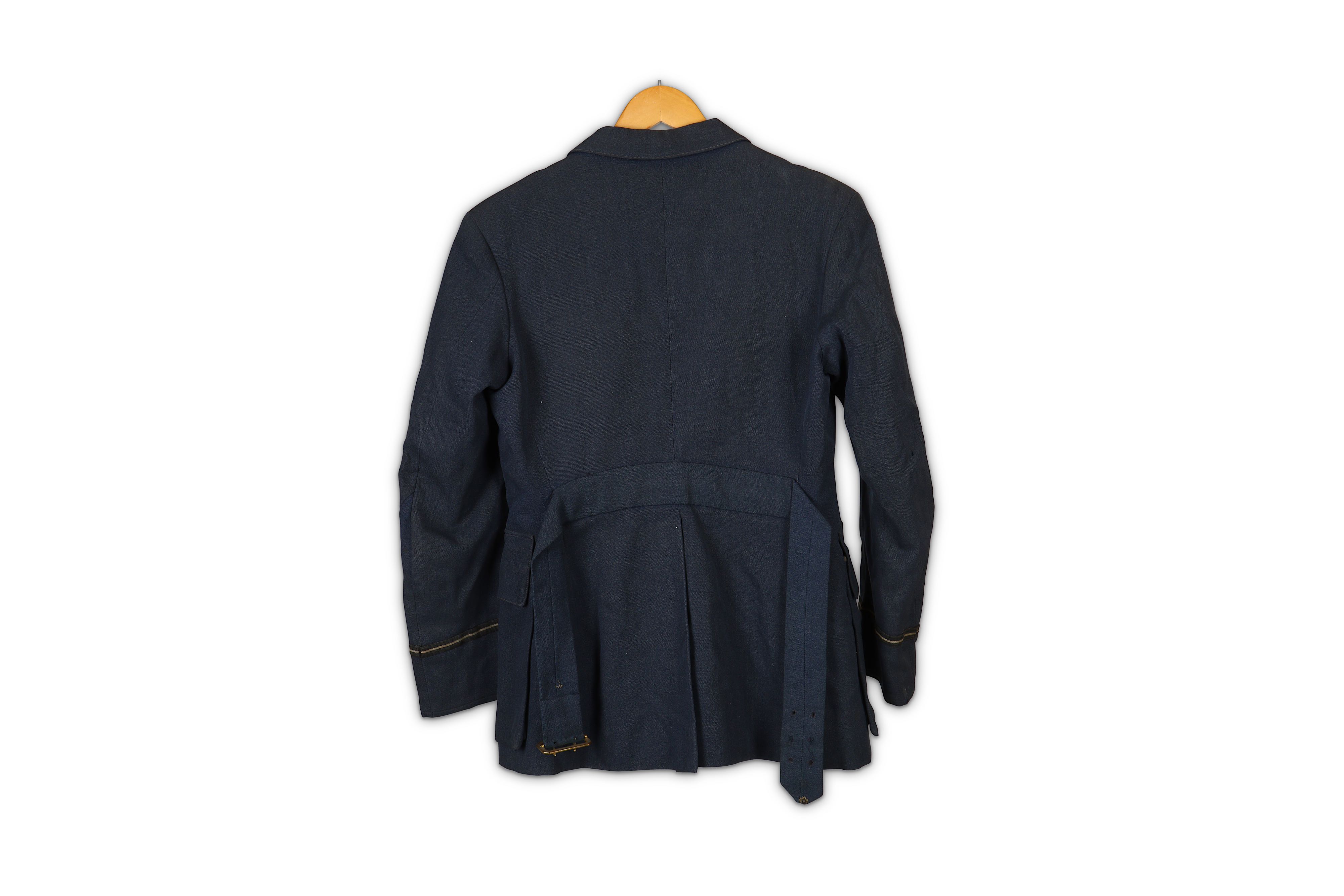 Lot 180 - The RAF jacket, badges and insignia of